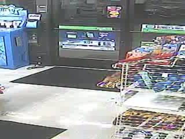 Man implies he has gun, robs 7-Eleven